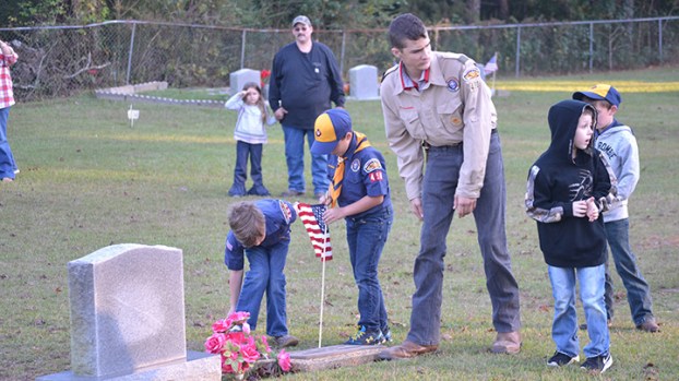 Brookhaven Cub Scouts and Boy Scouts place flags at graves of veterans ...